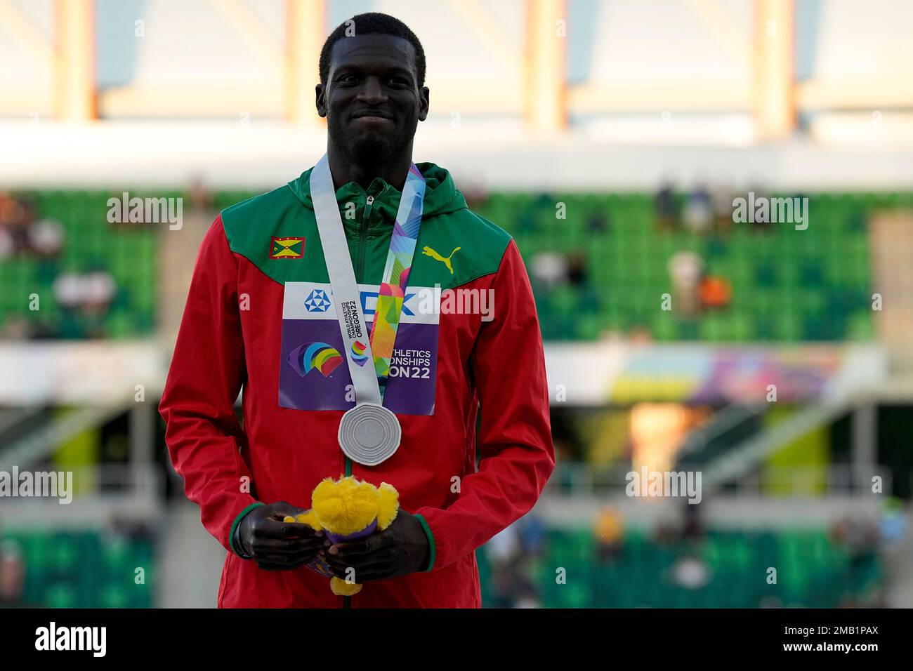 Silver medalist Kirani James, of Grenada, poses during a medal ceremony ...