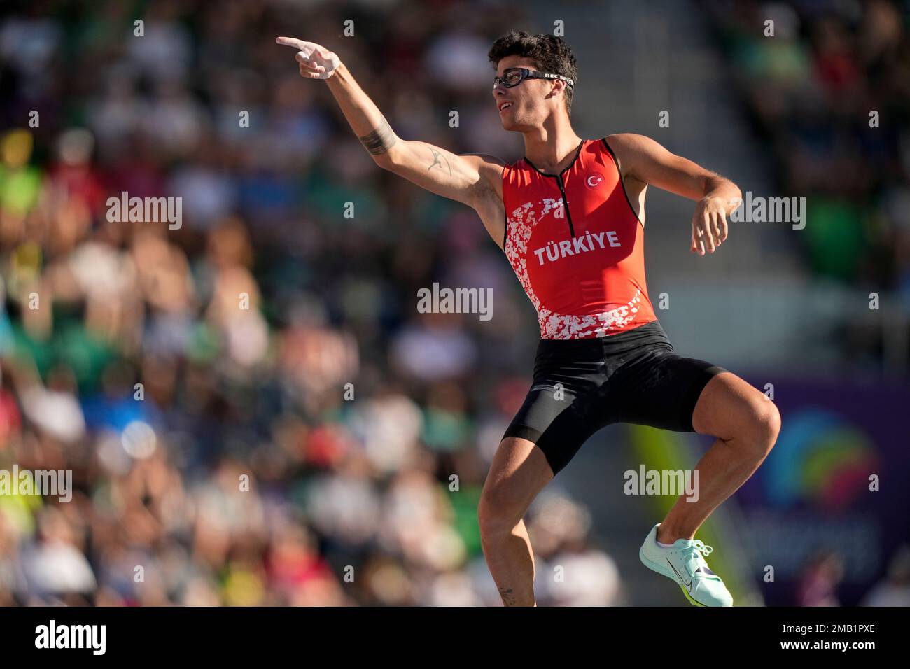 Ersu Sasma, of Turkey, competes in qualifications for the men's pole ...