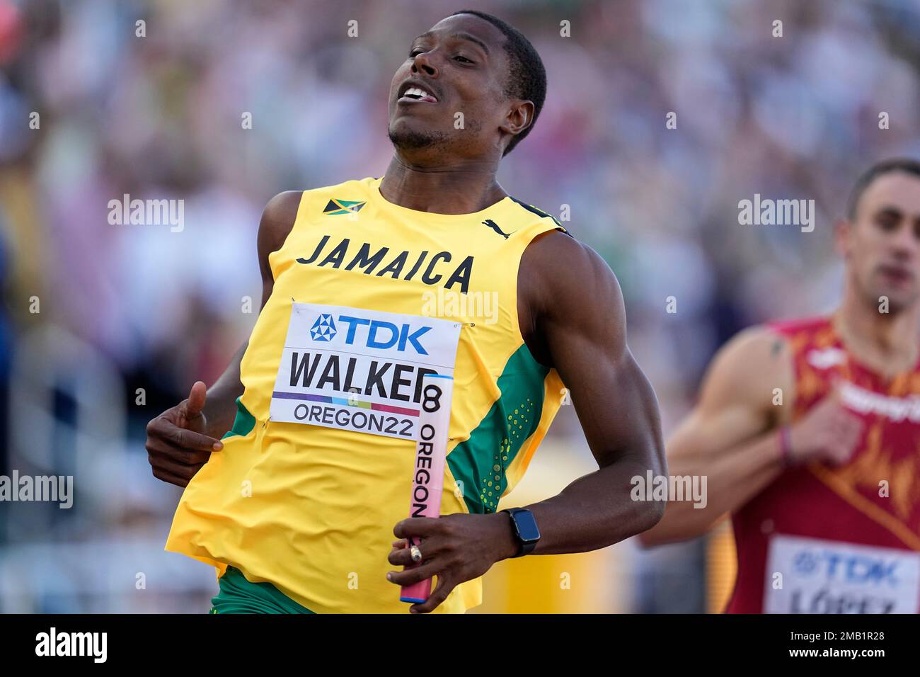 Jelani Walker, of Jamaica, competes in a heat during the men's 4x100 ...