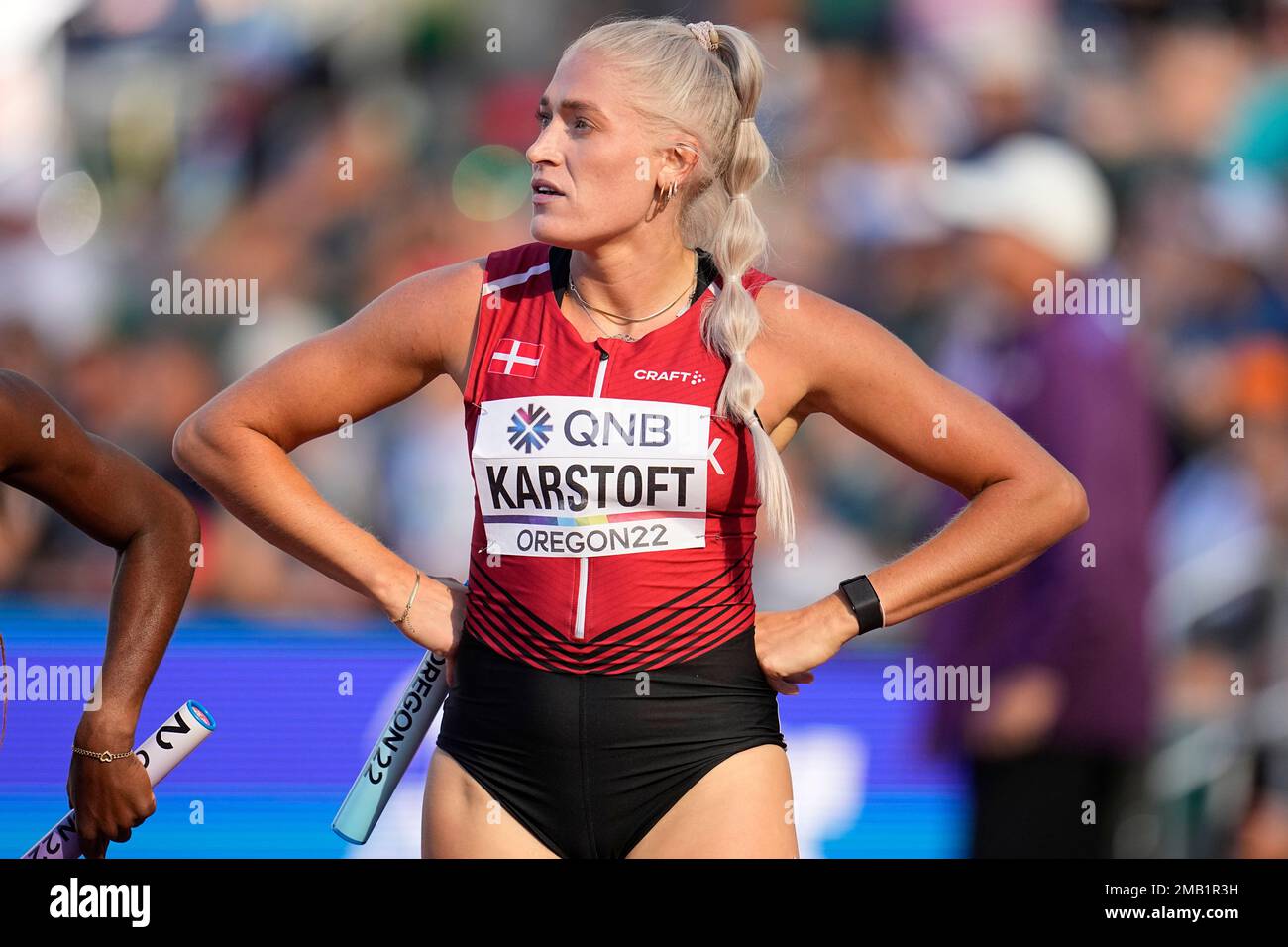Ida Karstoft, of Denmark, competes in a heat during the women's 4x100 ...