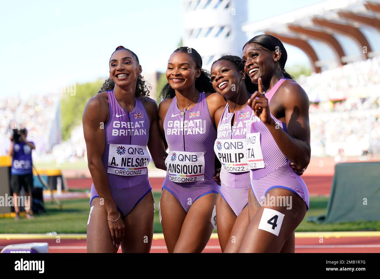 Team Britian poses after wins a heat during the women's 4x100-meter ...