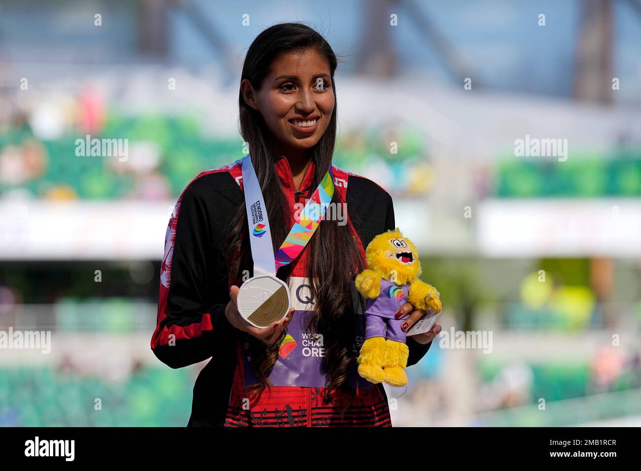 Gold medalist Kimberly Garcia Leon, of Peru, stands during a medal ...