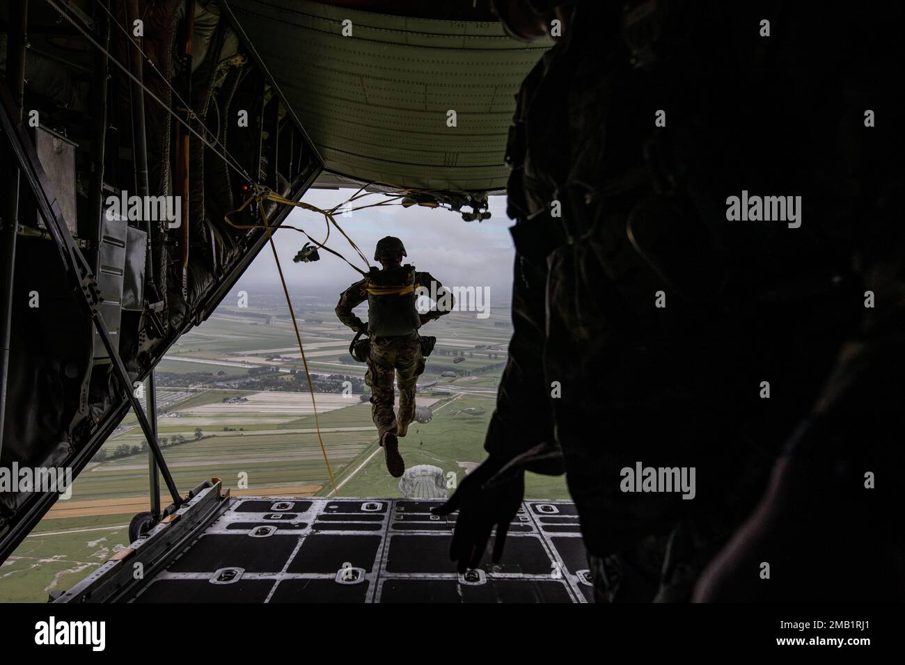 A U.S. Army Special Operations service member jumps from the ramp of an ...
