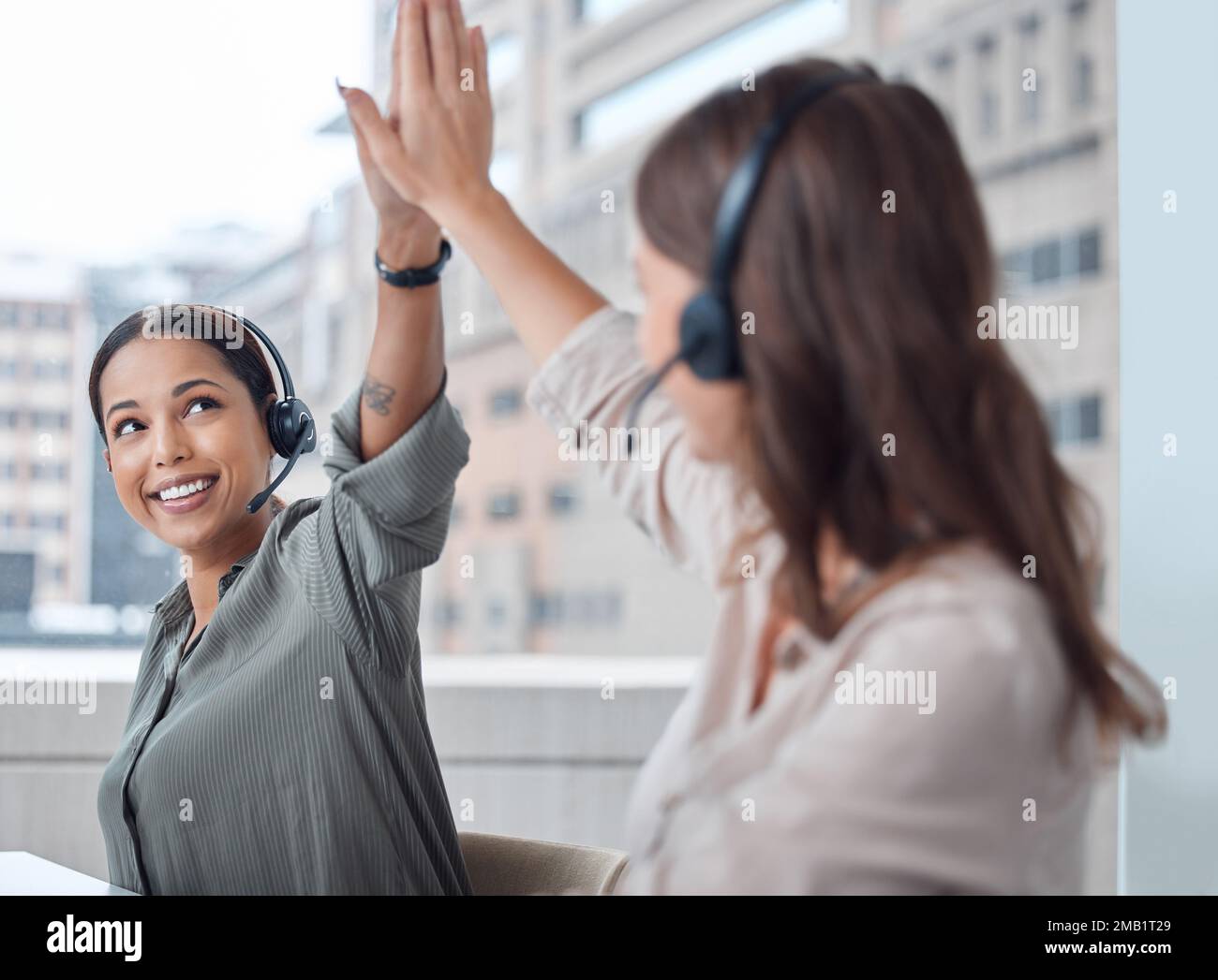 Yes you did so great. two businesswoman working in a call center high ...