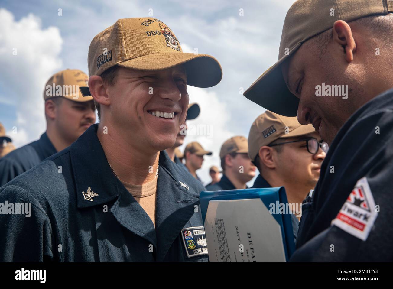 PHILIPPINE SEA (June 9, 2022) Cmdr. Jermaine Brooms, right, from ...