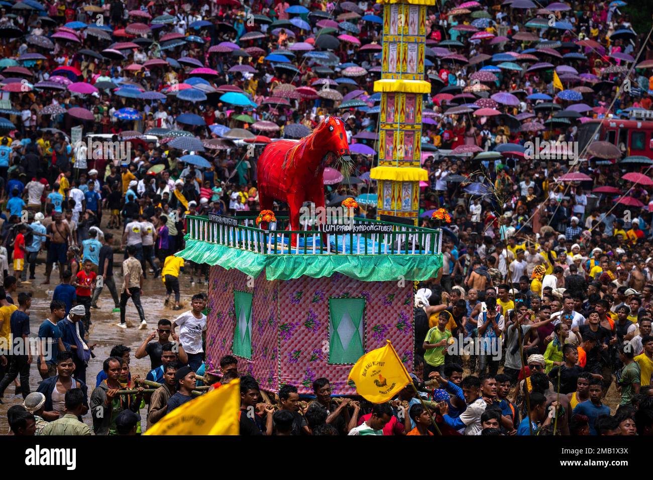 Pnar, or Jaintia, tribals carry 'Rongs' or chariots and dance in muddy ...