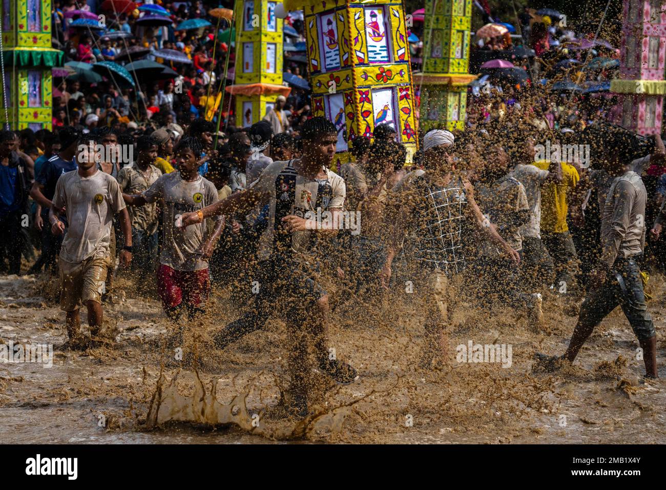 Pnar, or Jaintia, tribals carry 'Rongs' or chariots and dance in muddy ...