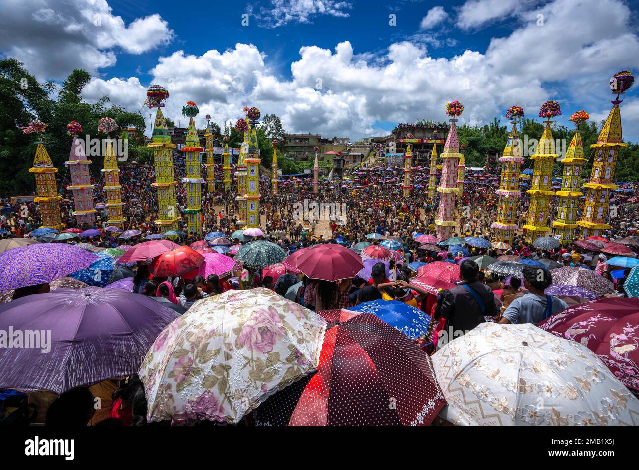 Pnar, or Jaintia, tribals carry 'Rongs' or chariots and dance in muddy ...