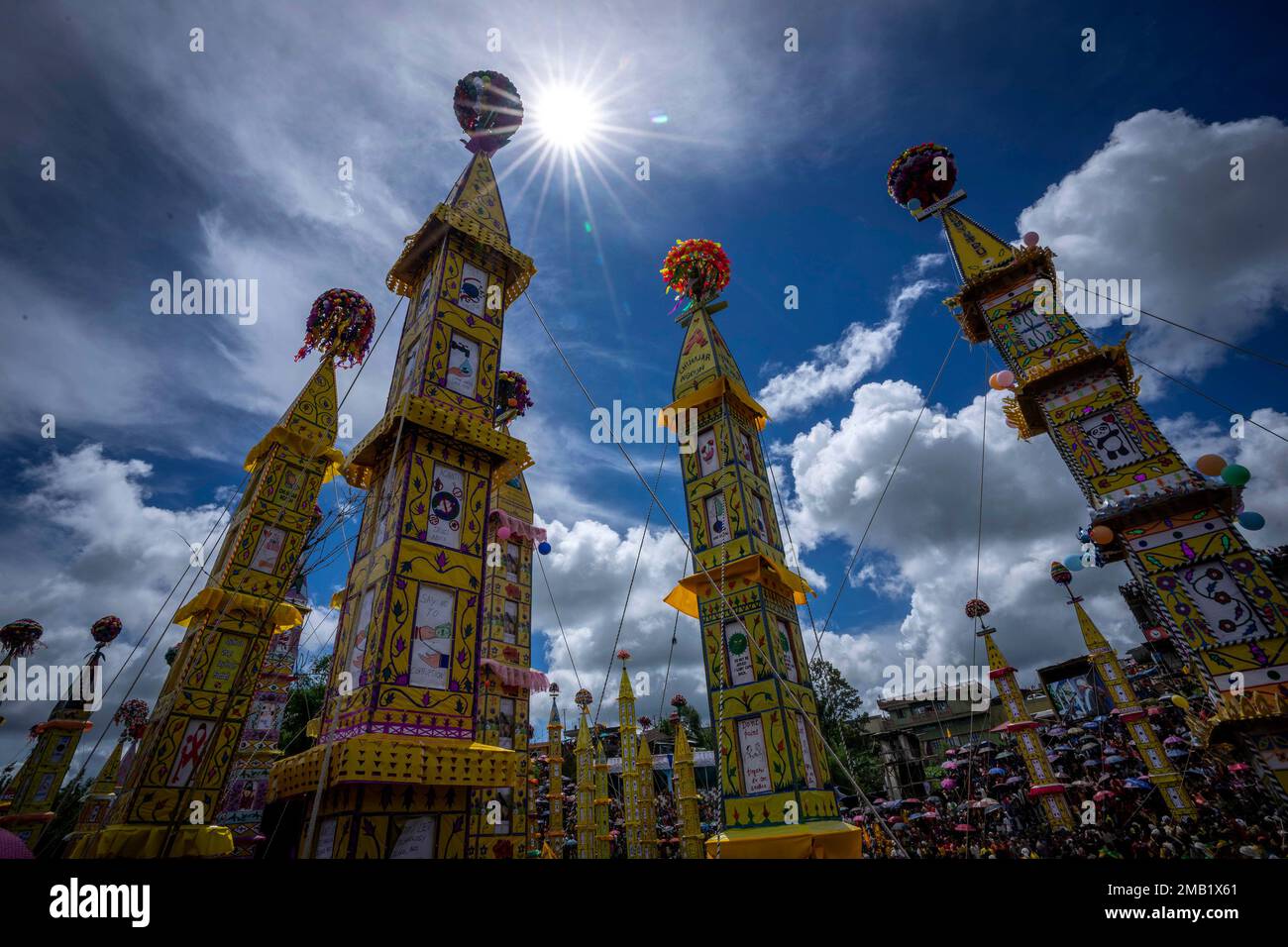 Pnar, or Jaintia, tribals carry 'Rongs' or chariots and dance in muddy ...