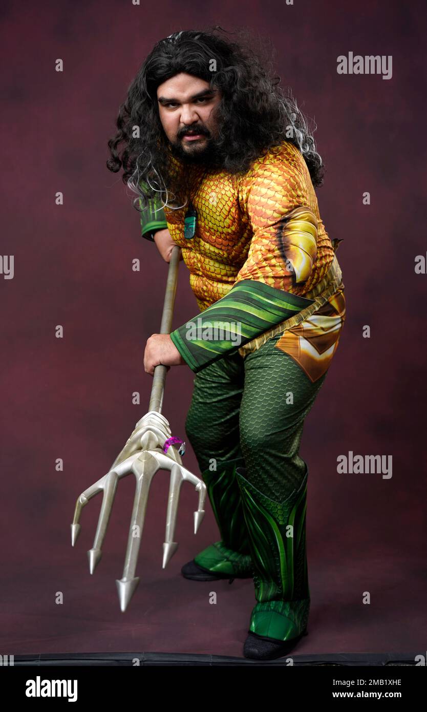 Jose Cuadros, of Escondido, Calif., dressed as Aquaman, poses for a ...