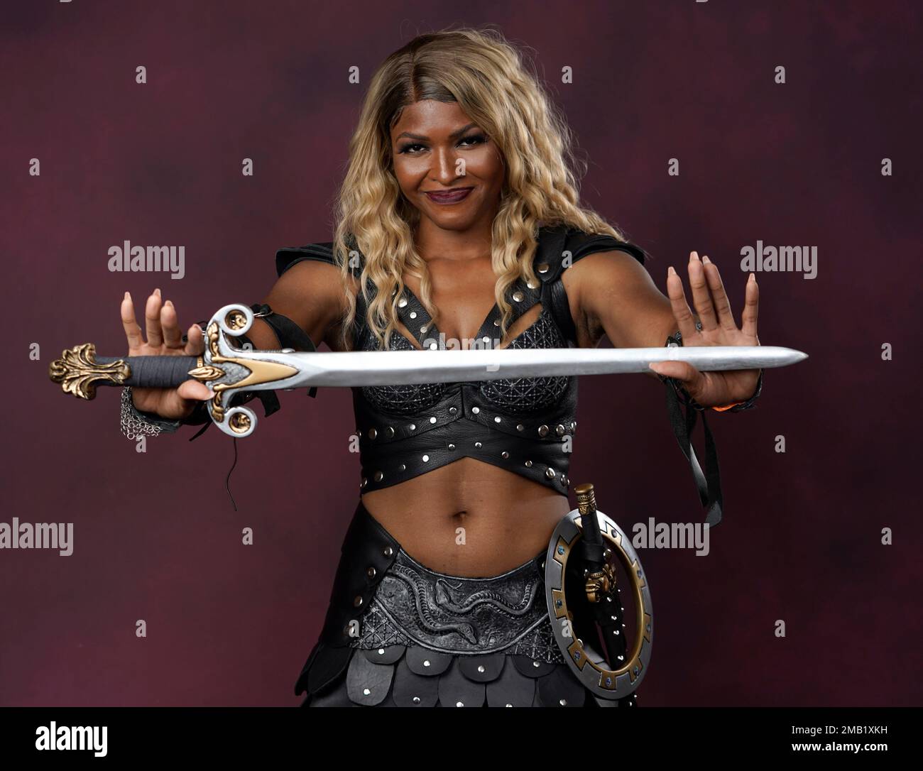Jan Benjamin of New York, dressed as Xena Warrior Princess, poses for a ...