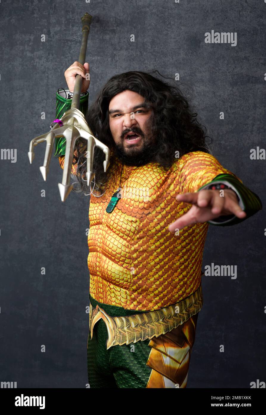 Jose Cuadros, of Escondido, Calif., dressed as Aquaman, poses for a ...