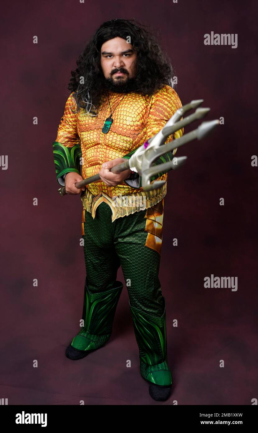 Jose Cuadros, of Escondido, Calif., dressed as Aquaman, poses for a ...