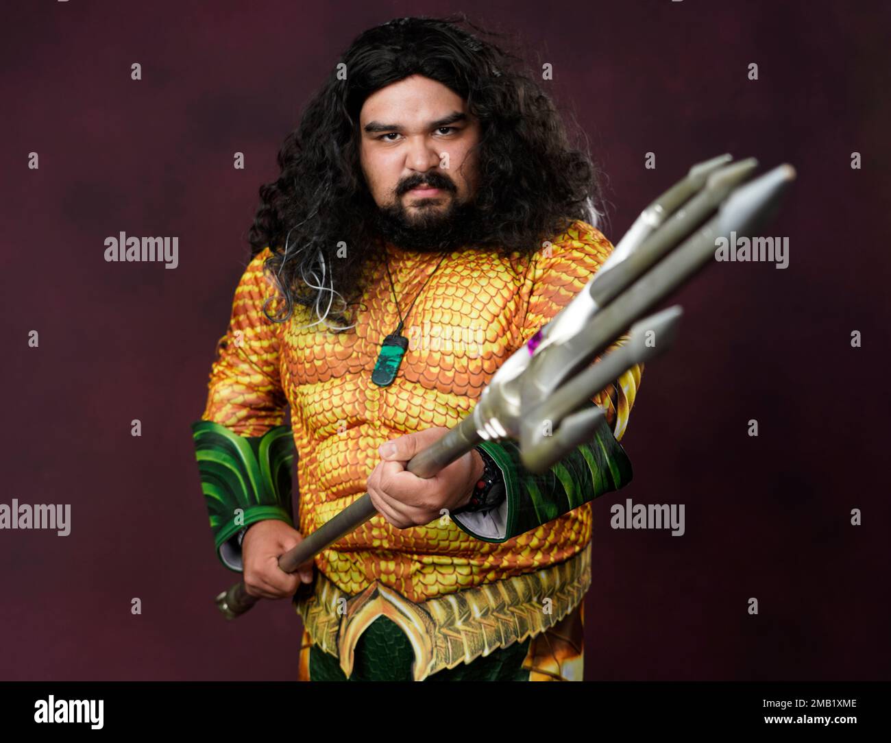 Jose Cuadros, of Escondido, Calif., dressed as Aquaman, poses for a ...