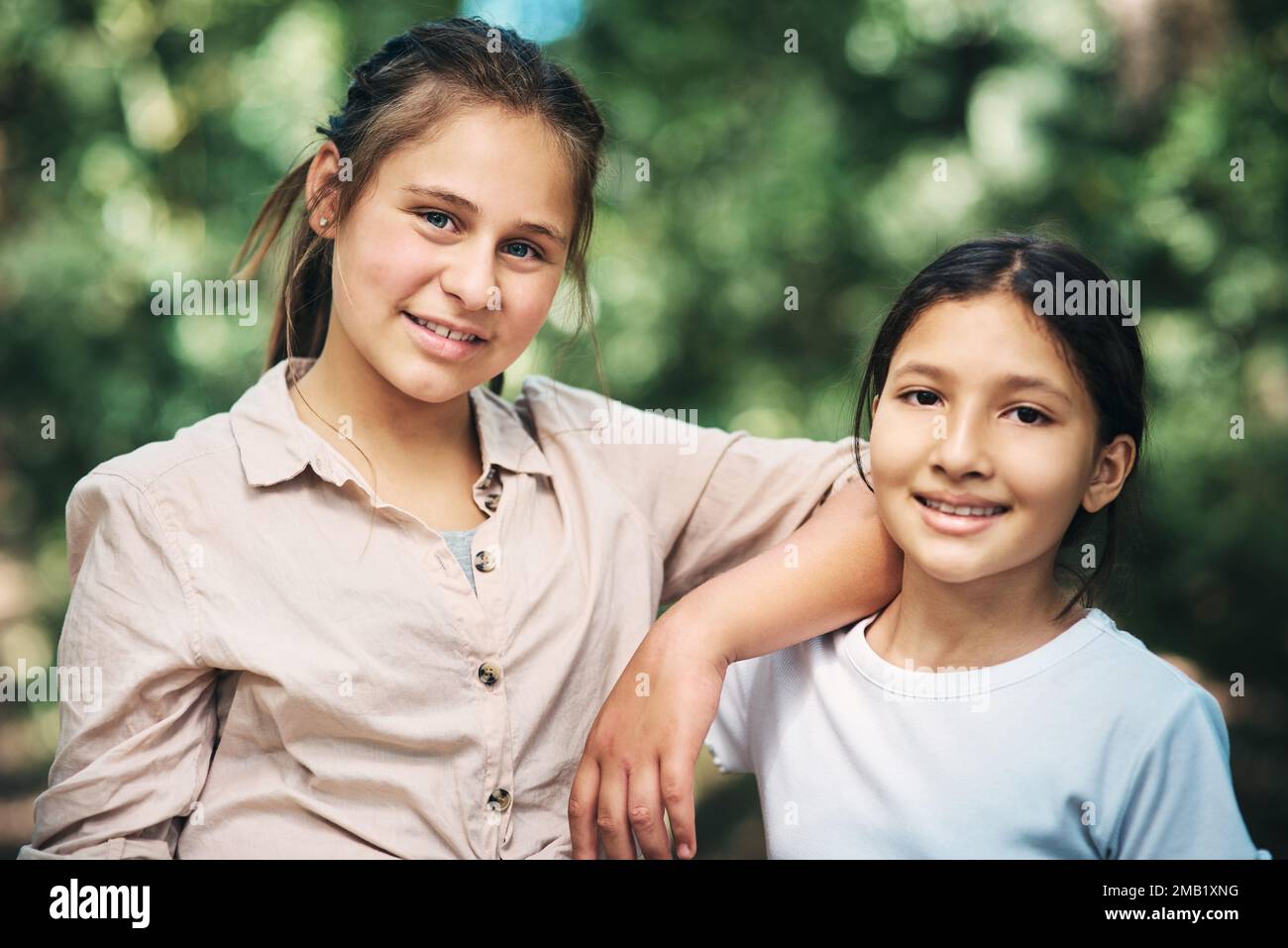 Two besties in a summer camp pod. two teenage girls embracing in nature ...