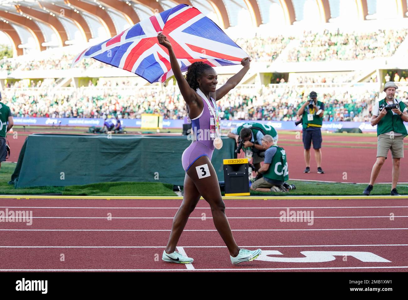 Bronze medalist Dina Asher-Smith, of Britain, walks the track after the ...