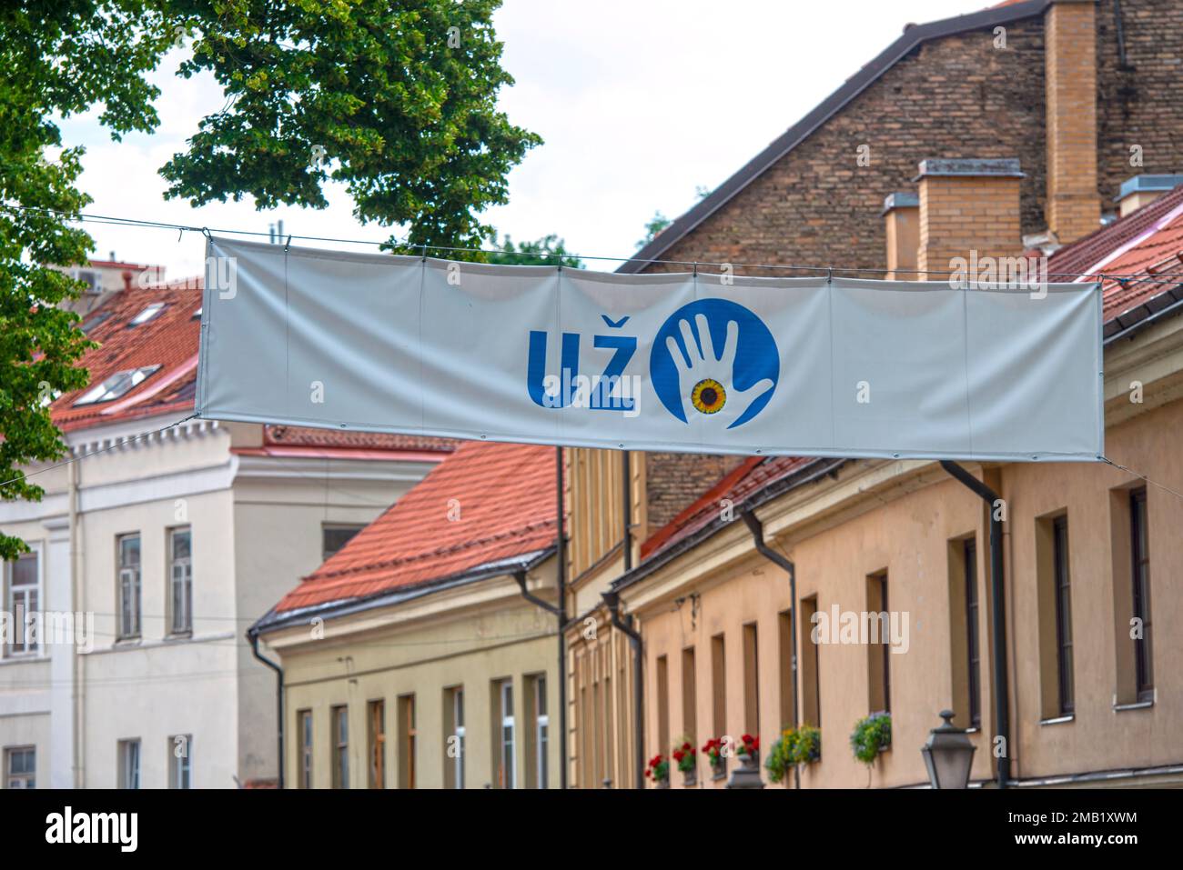 VILNIUS - JULY 07: Signboard of Uzupis is a neighborhood in Vilnius on ...