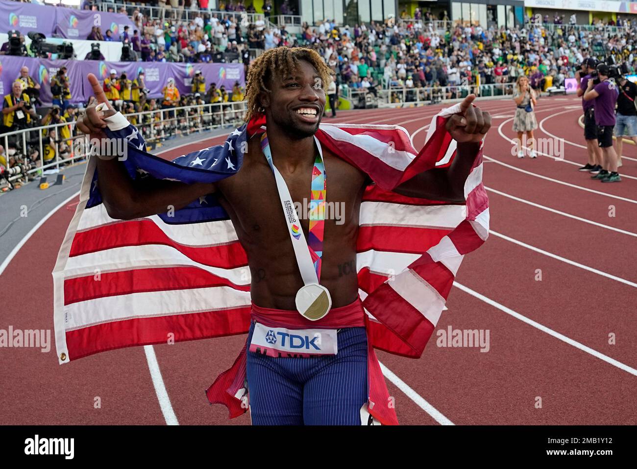 Noah Lyles, of the United States, celebrates after winning the men's ...