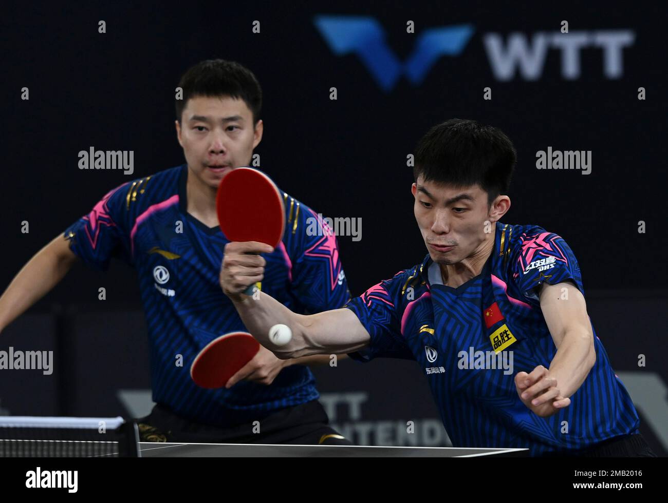 Doha, Qatar. 19th Jan, 2023. Zhou Kai/Yu Ziyang (L) compete during the ...