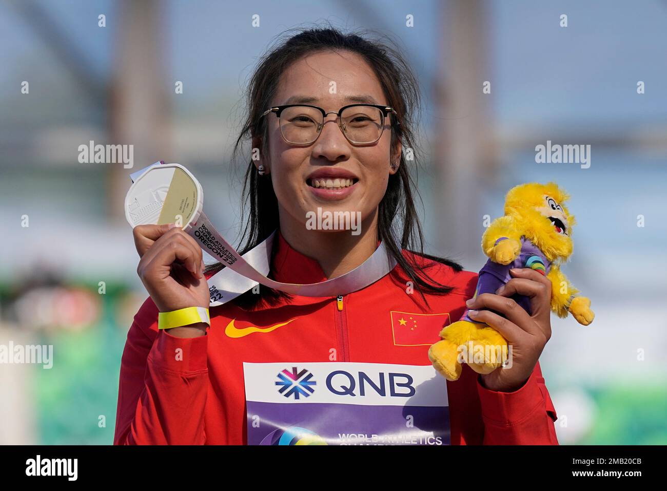 Gold medalist Bin Feng, of China, poses during a medal ceremony for the ...