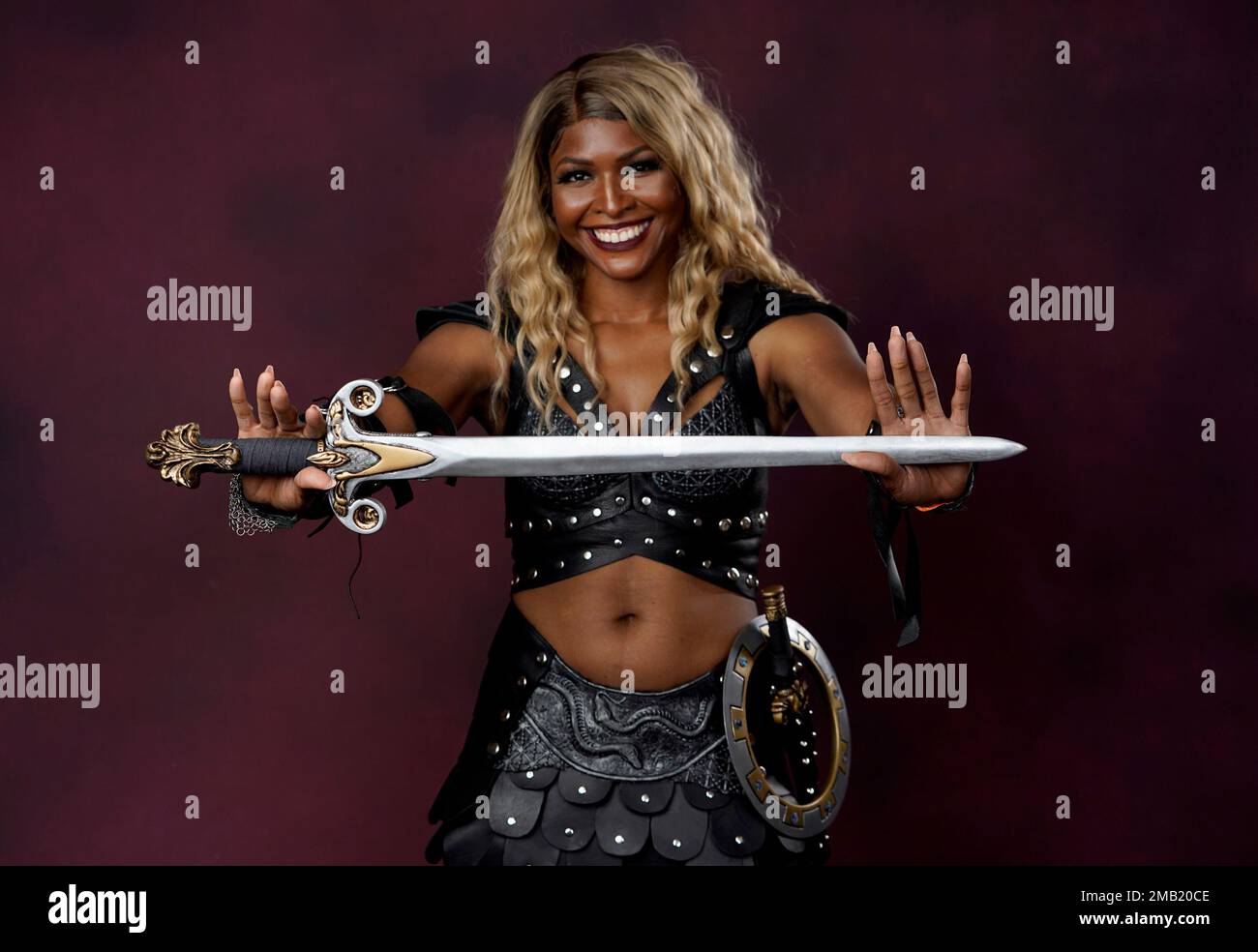 Jan Benjamin, of New York, dressed as Xena Warrior Princess, poses for ...
