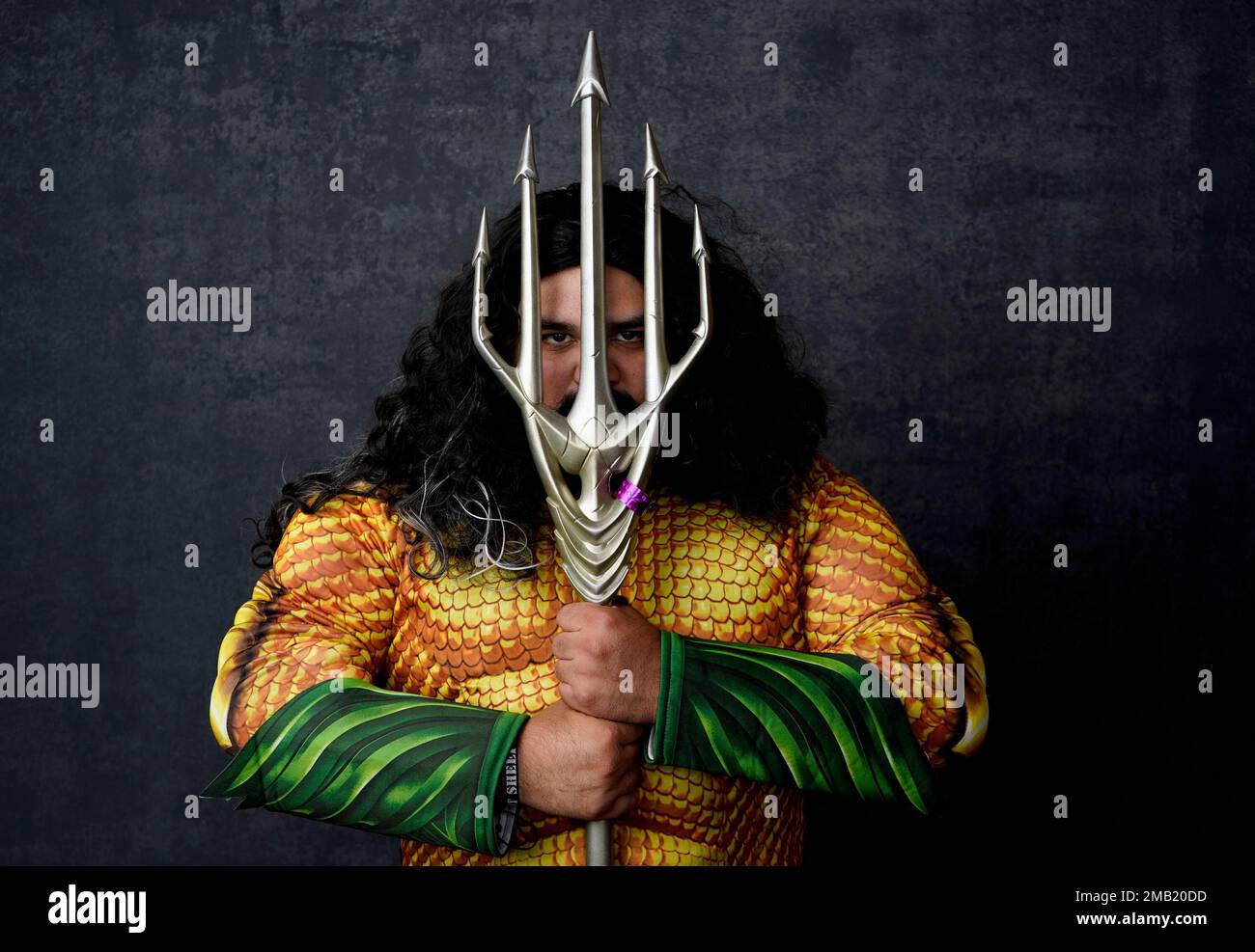 Jose Cuadros, of Escondido, Calif., dressed as Aquaman, poses for a ...