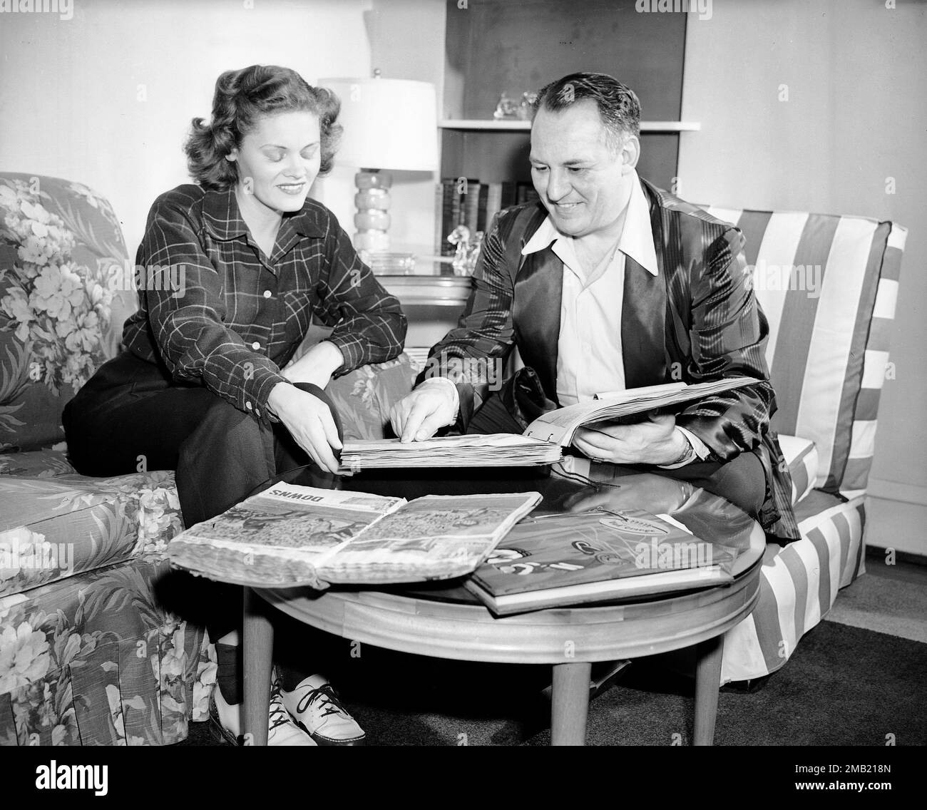 Harold "Red" Grange, right, and his wife Margaret look over a few of ...