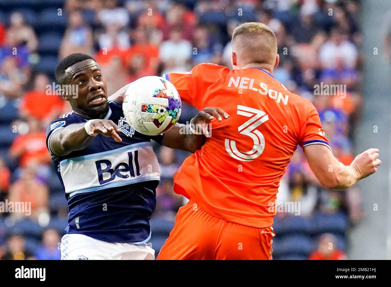 FC Cincinnati defender John Nelson (3) and Vancouver Whitecaps forward ...