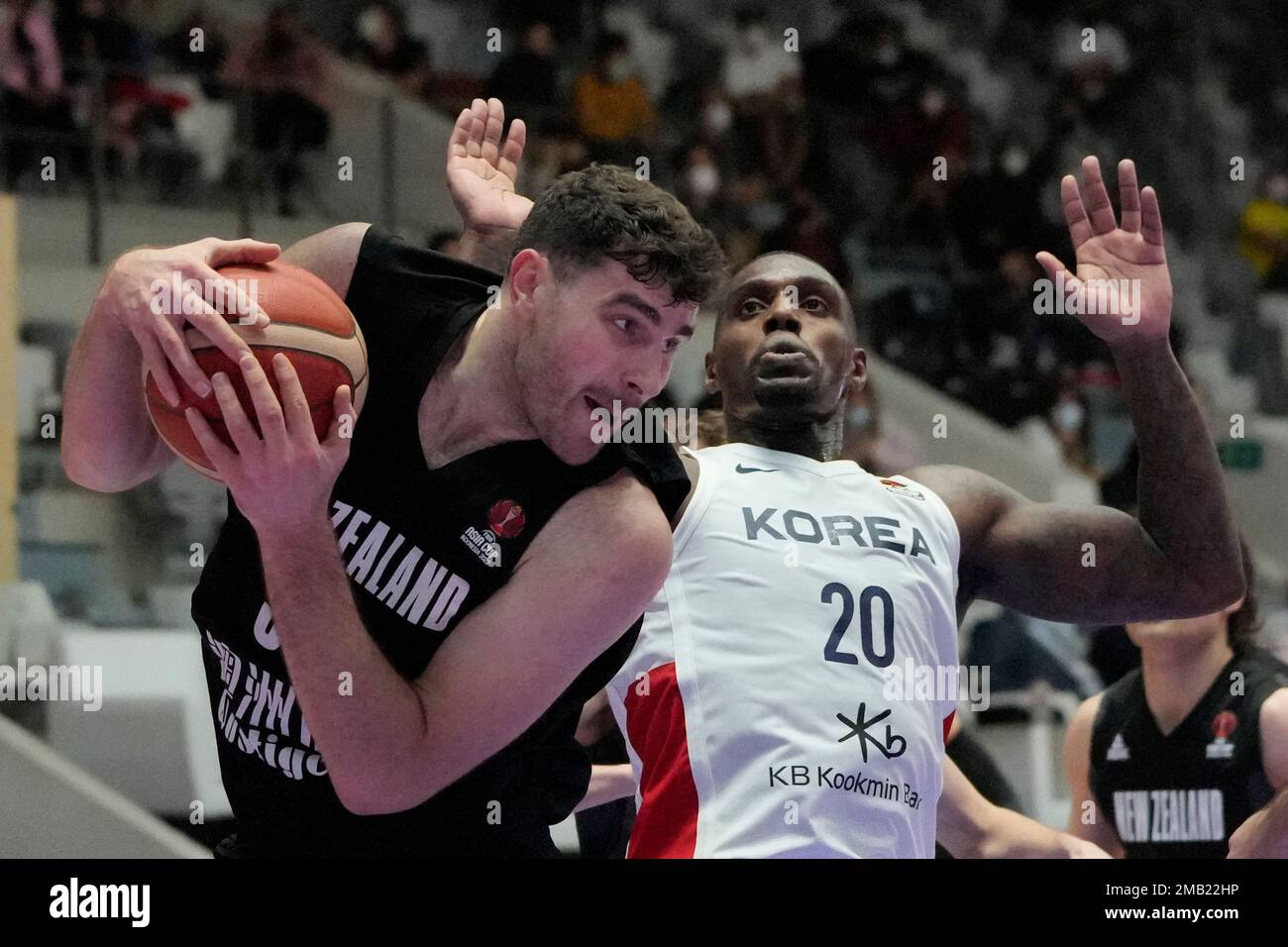 New Zealand's Sam Timmins. left, battles for a rebound against South ...