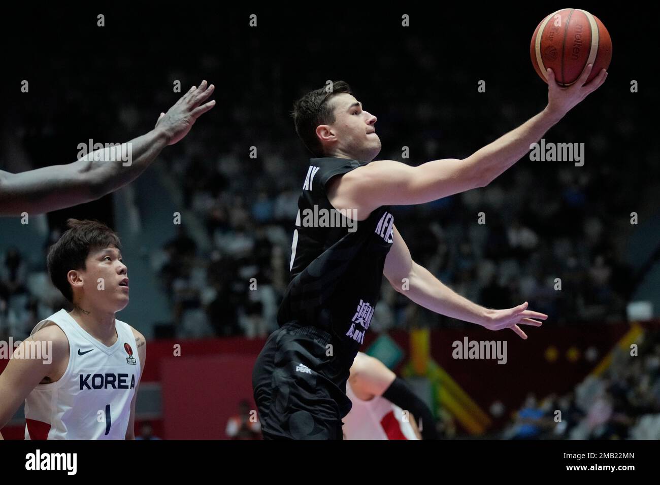 New Zealand's Taine Murray shoots past South Korea's Choi Jun-yong ...