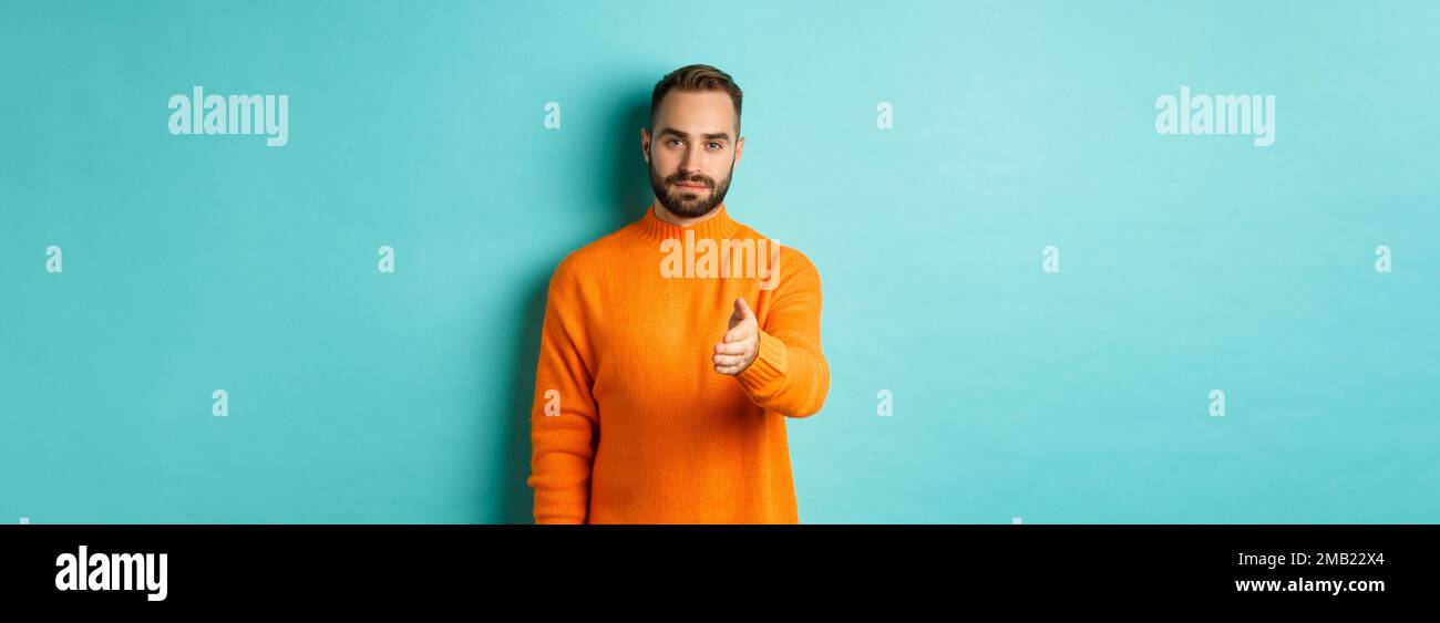 Confident man extending hand for handshake, greeting you, looking self ...