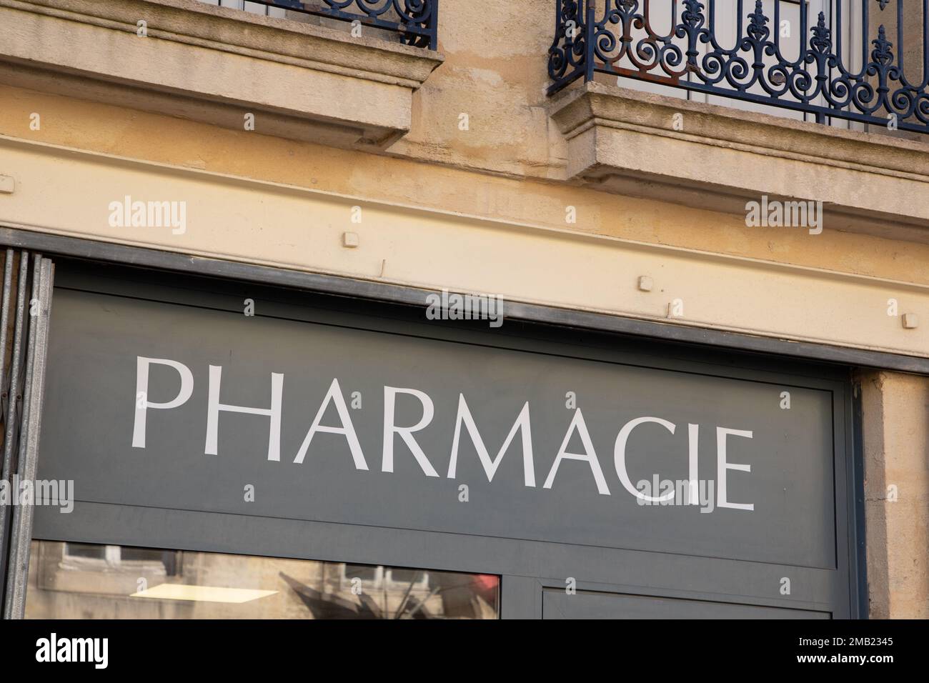 french text pharmacie mean pharmacy sign wall building facade entrance ...