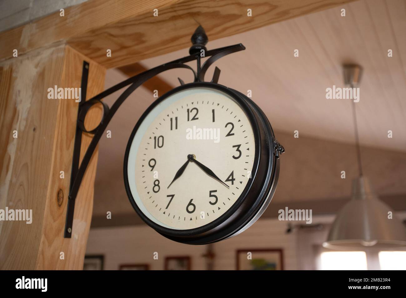 Vintage timer round old big white black Clock in wall interior with ...