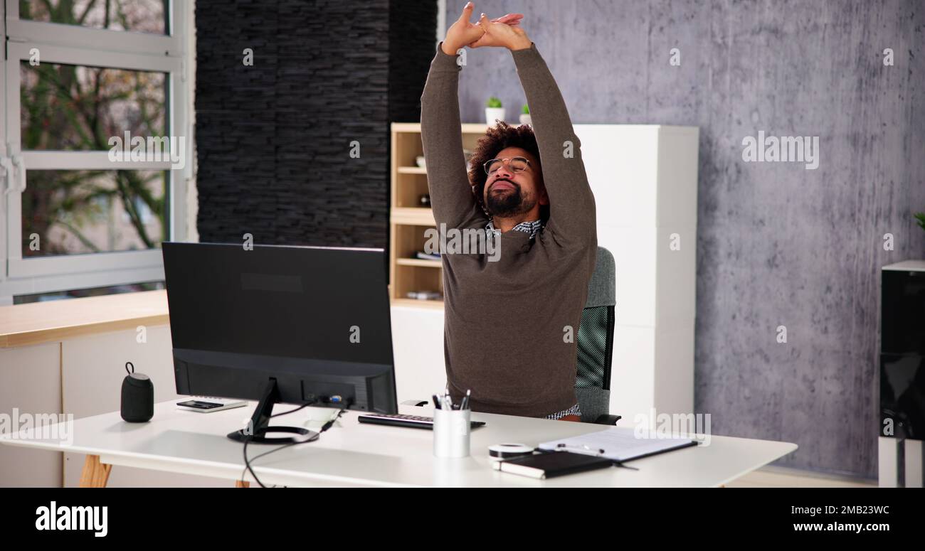 Stretch Exercise Workout At Office Business Desk Stock Photo - Alamy