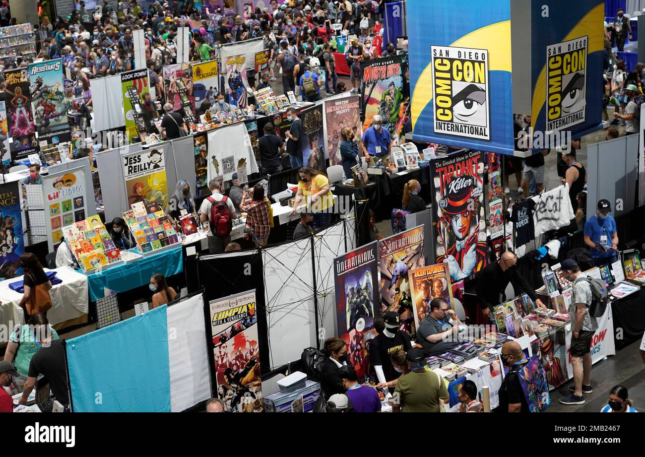 Comic-Con attendees walk the convention show floor during Preview Night ...