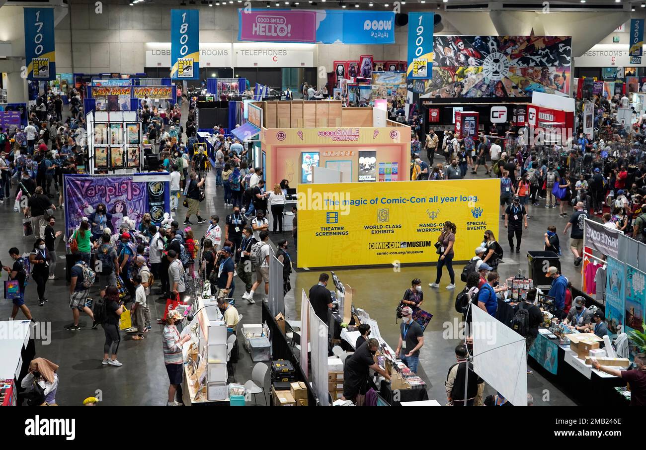Comic-Con attendees walk the convention show floor during Preview Night ...