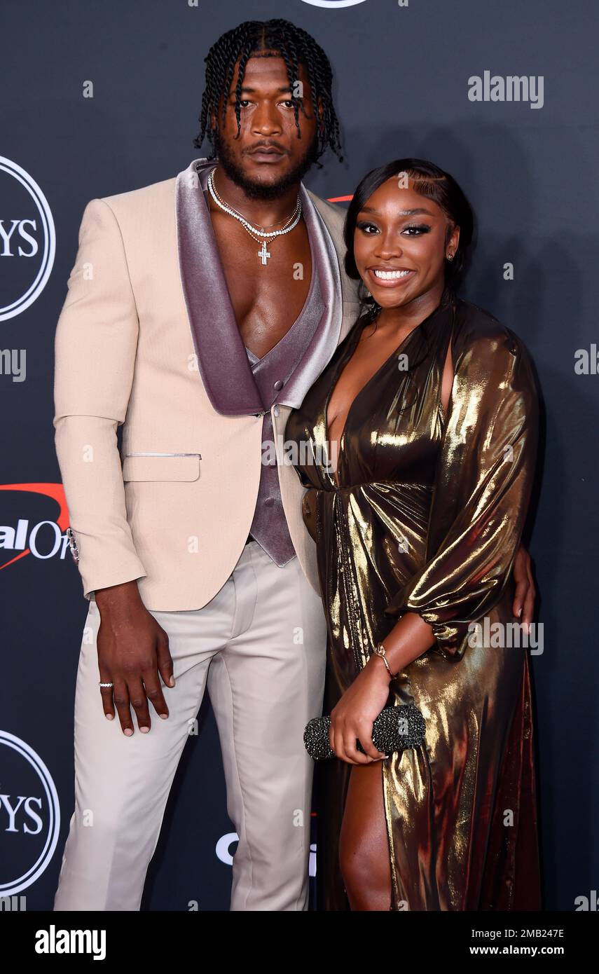 NFL player Ernest Jones of the Los Angeles Rams, left, arrives at the ...