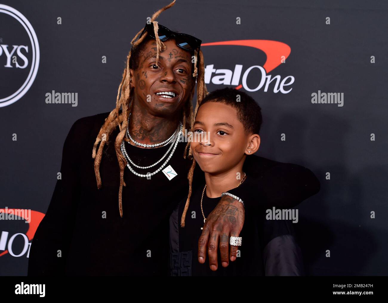 Lil Wayne, left, and Kameron Carter arrive at the ESPY Awards on ...