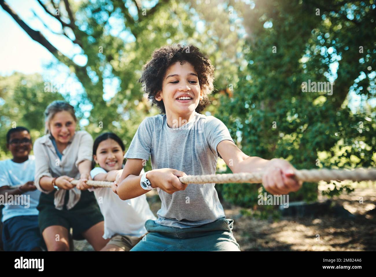 Together a team achieves more. a group of teenagers playing a game of ...