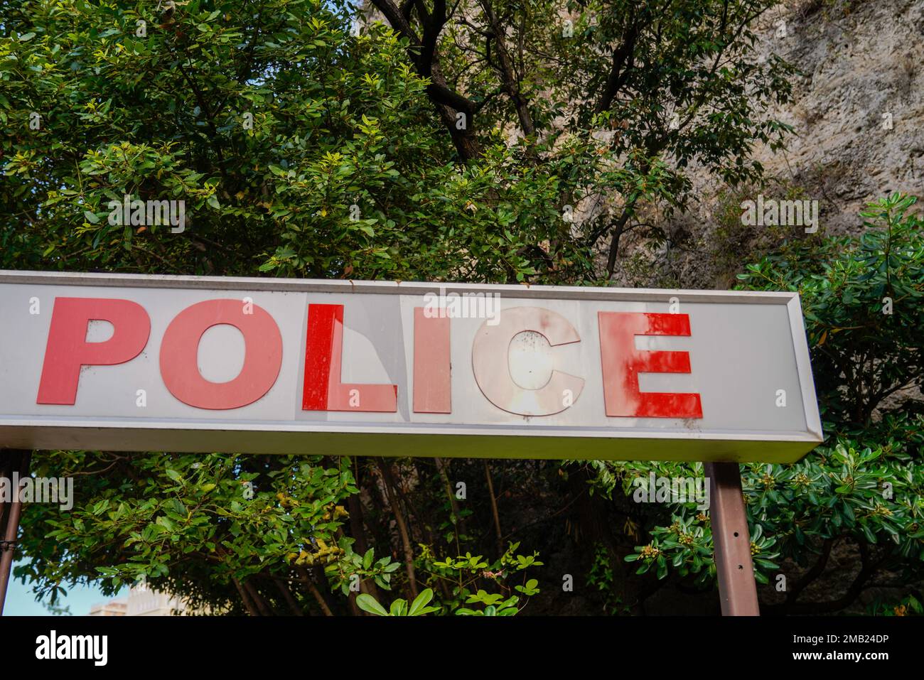 Police Station red text sign in building city street Stock Photo - Alamy