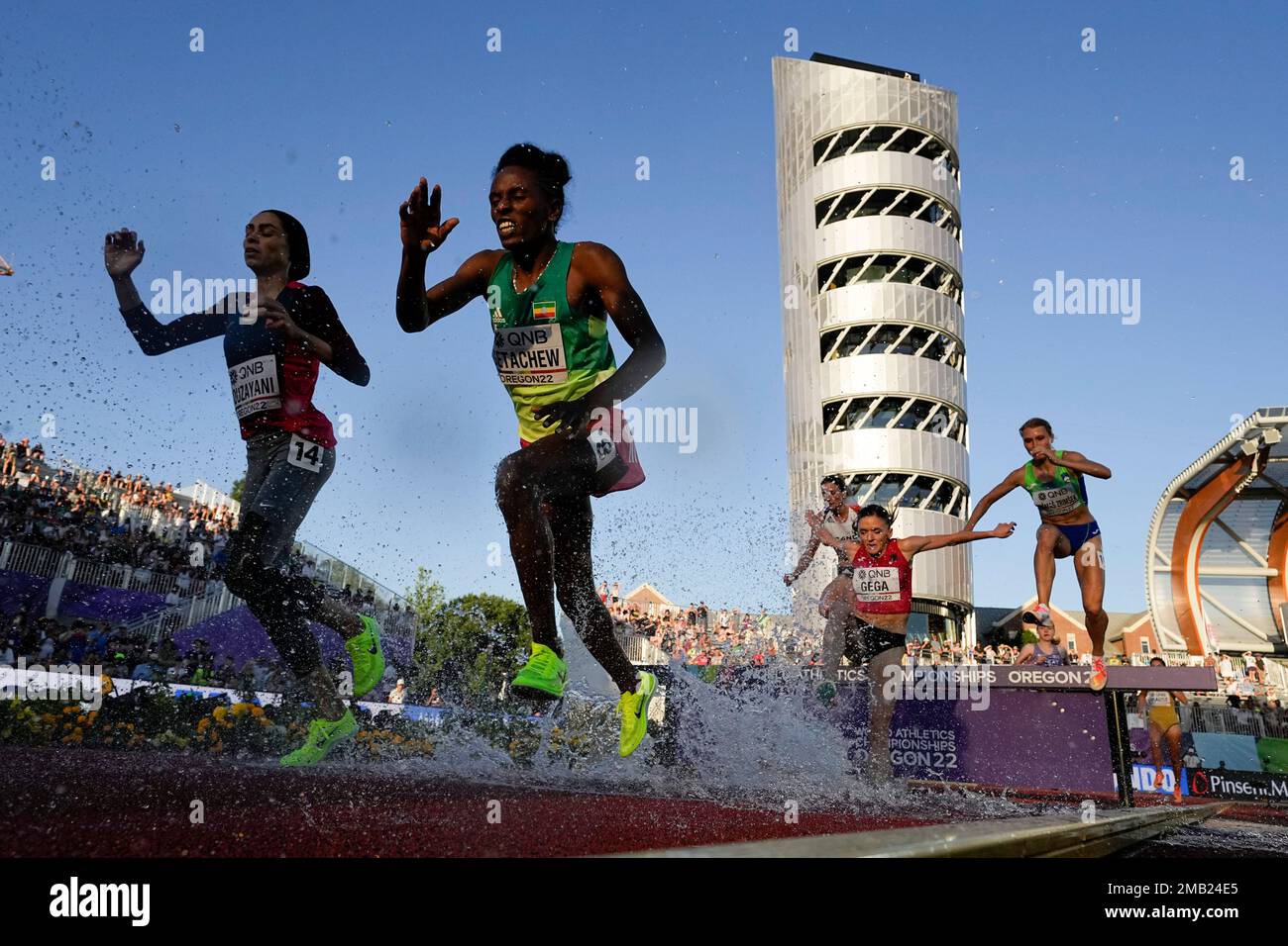 Runner competes in the women's 3000-meter steeplechase final at the ...