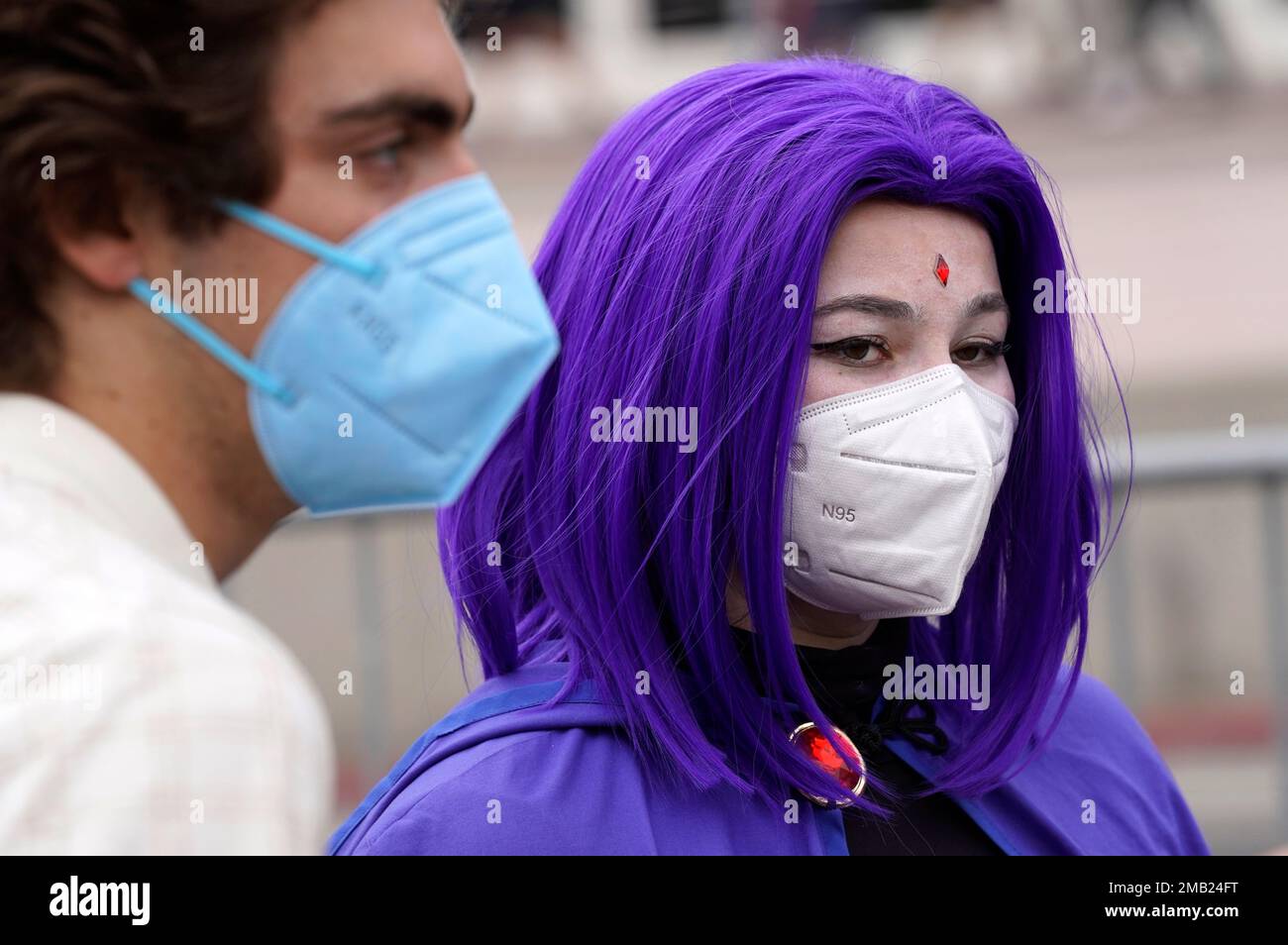 Aiden Molter, left, and Monica Radin, both of San Diego, wear masks as ...