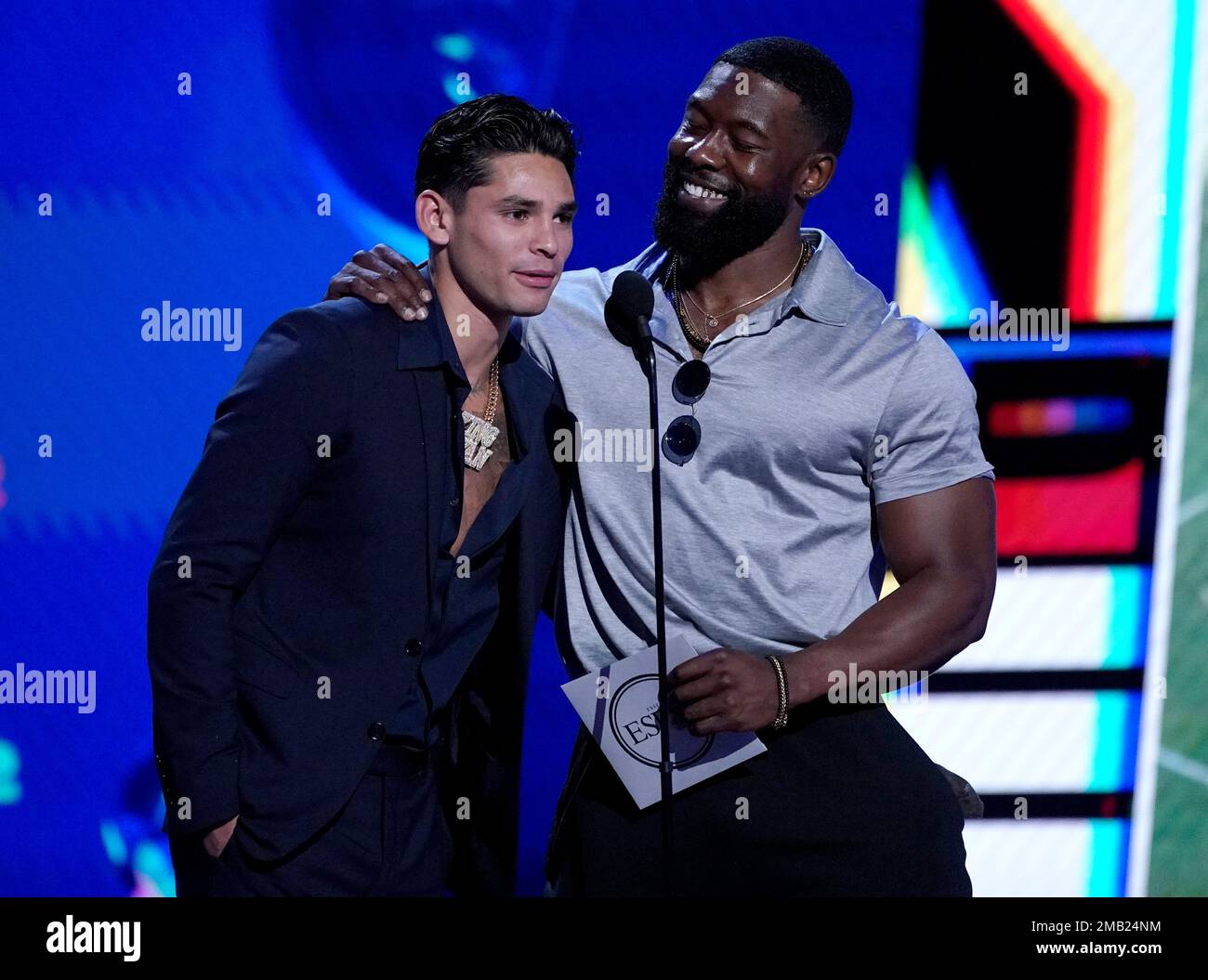 Boxer Ryan Garcia, left, and Trevante Rhodes present the award for best ...