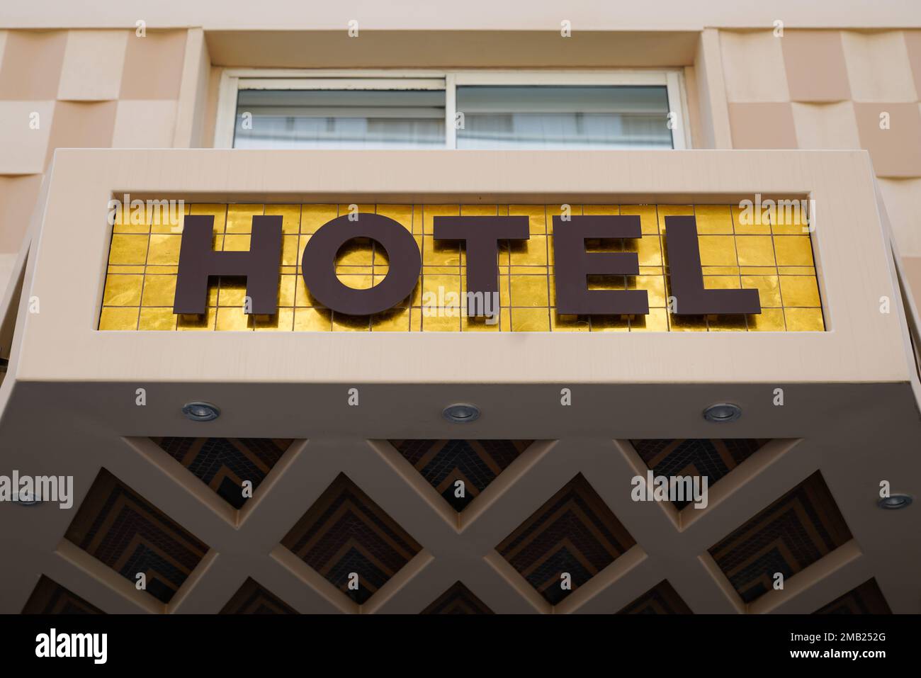 Hotel sign text in wall building entrance facade in tourist city Stock ...