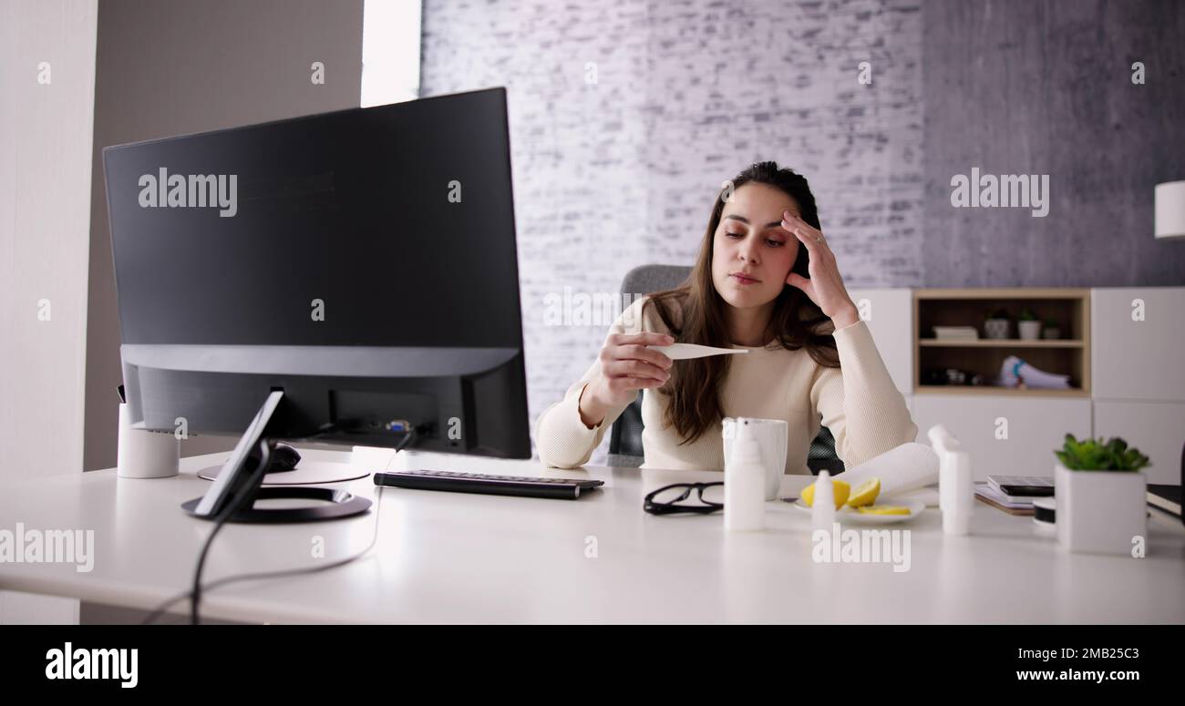 Sick Office Worker With Flu. Employee At Desk With Cold Stock Photo - Alamy