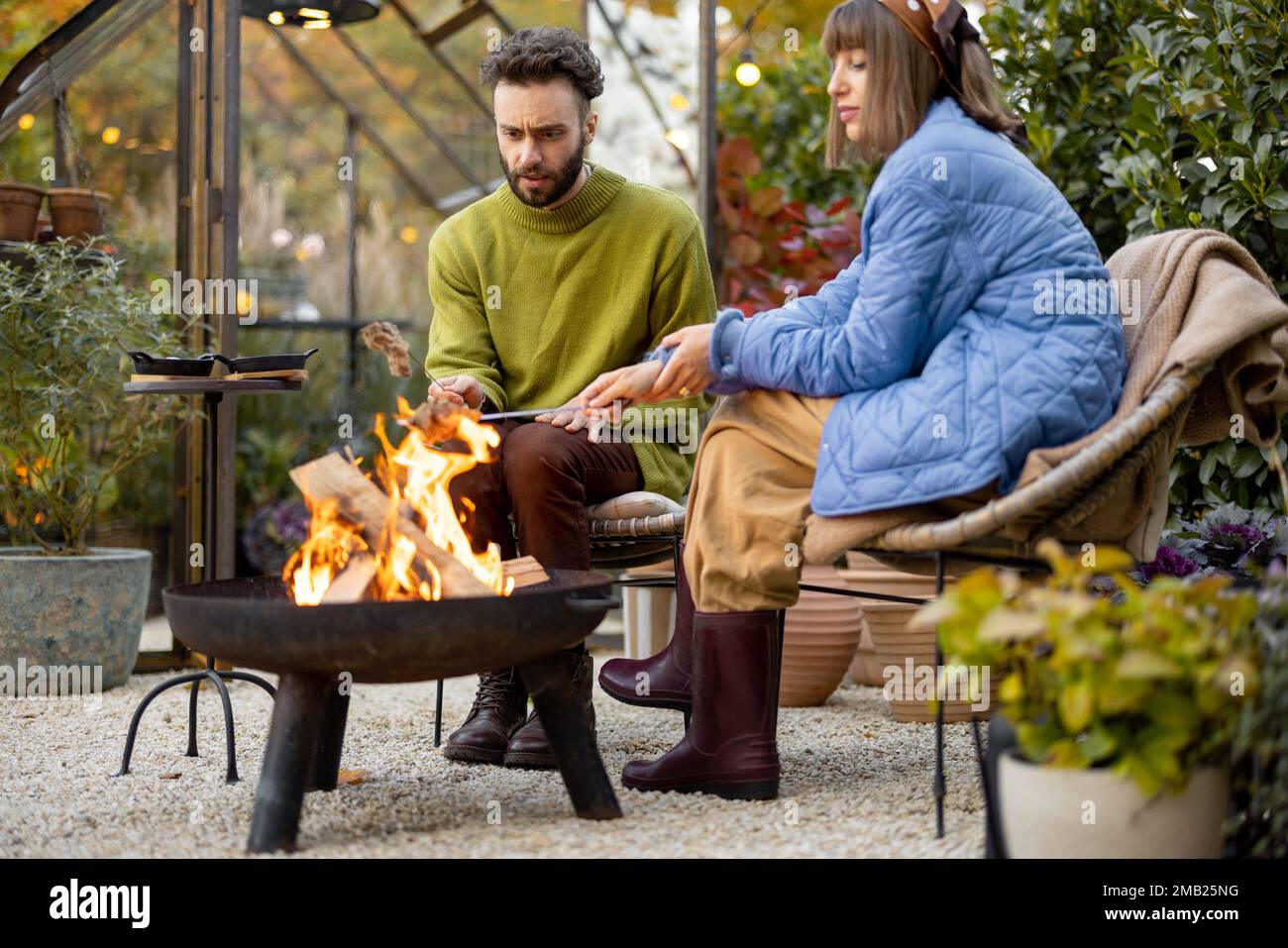 Man sitting fire drink hi-res stock photography and images - Alamy