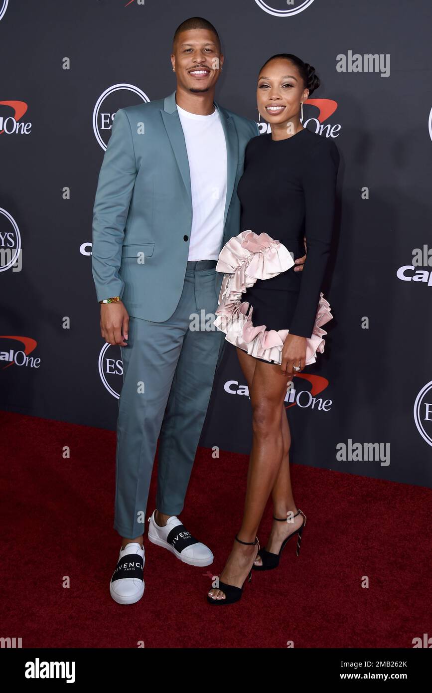 Sprinter and hurdler Kenneth Ferguson, left, and track and field runner ...