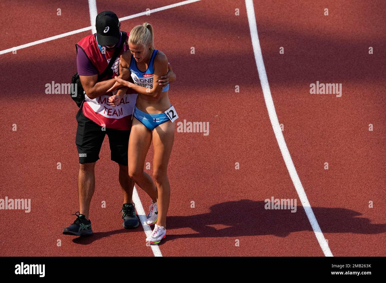 Camilla Richardsson, of Finland, is helped off the track during a heat ...