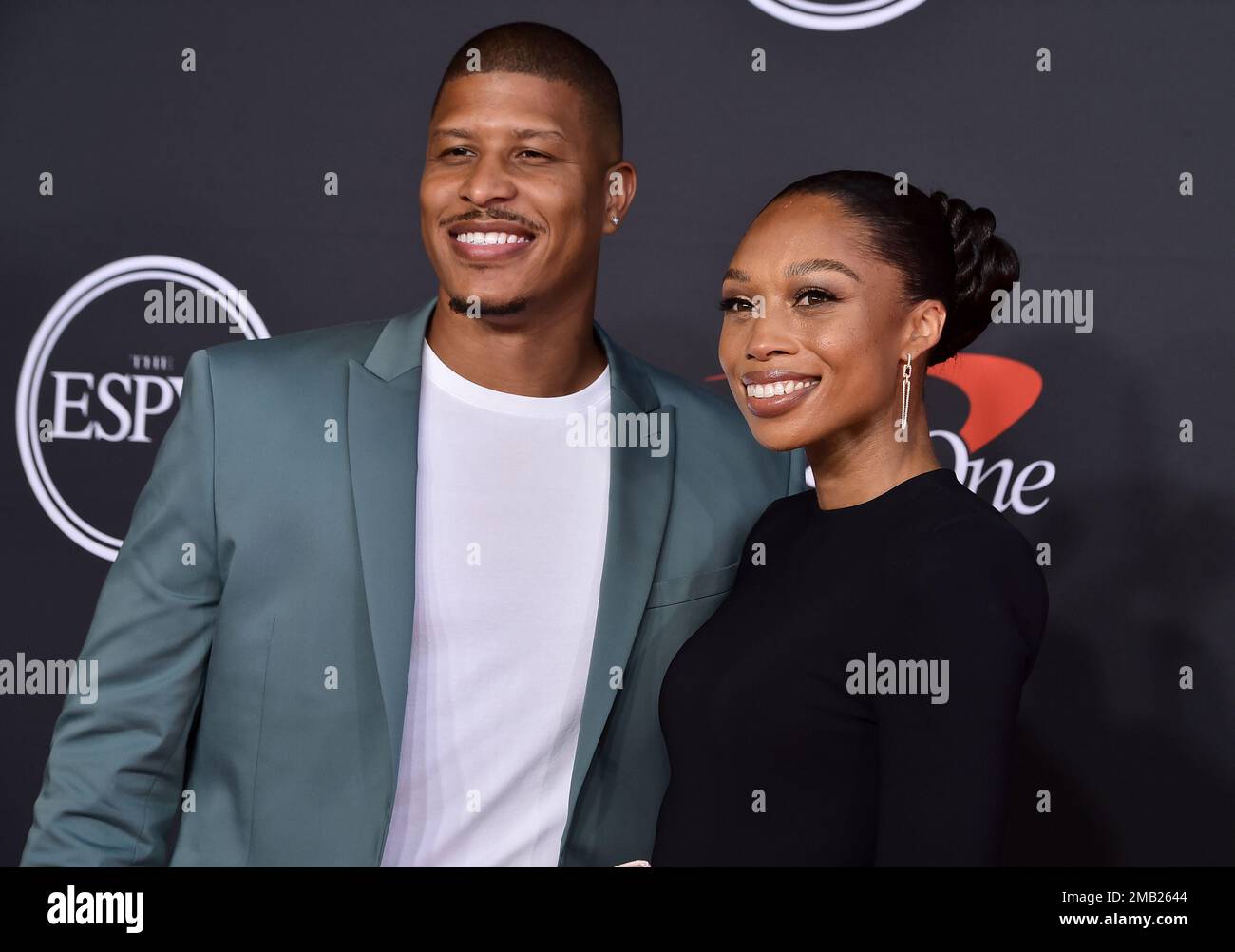Sprinter and hurdler Kenneth Ferguson, left, and track and field runner ...