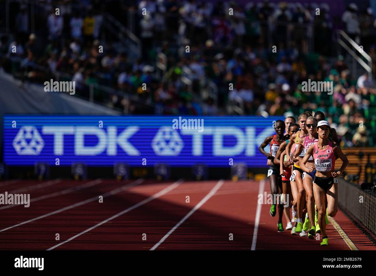 Women compete during a heat in the women's 5000-meter run at the World ...